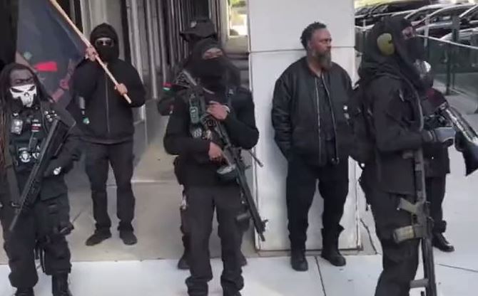 Armed militants demonstrate in favor of Sheila’s reparations bill
